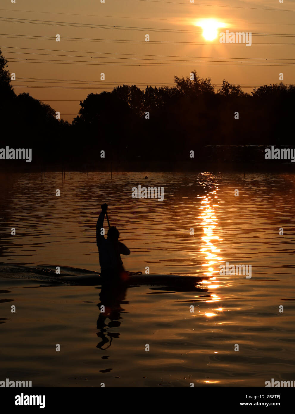 A C1 canoe athlete warms up on the practice lake during day five of the ...