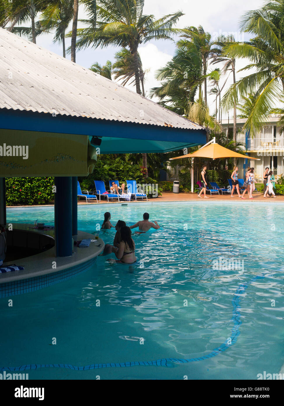 Relaxing by the pool at Daydream Island Resort; Whitsunday Islands, QLD ...