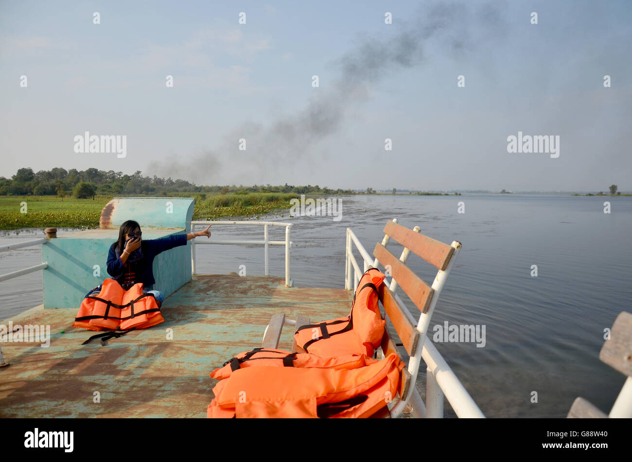 Thai woman sit and took the hand-off nose protect smell from air ...