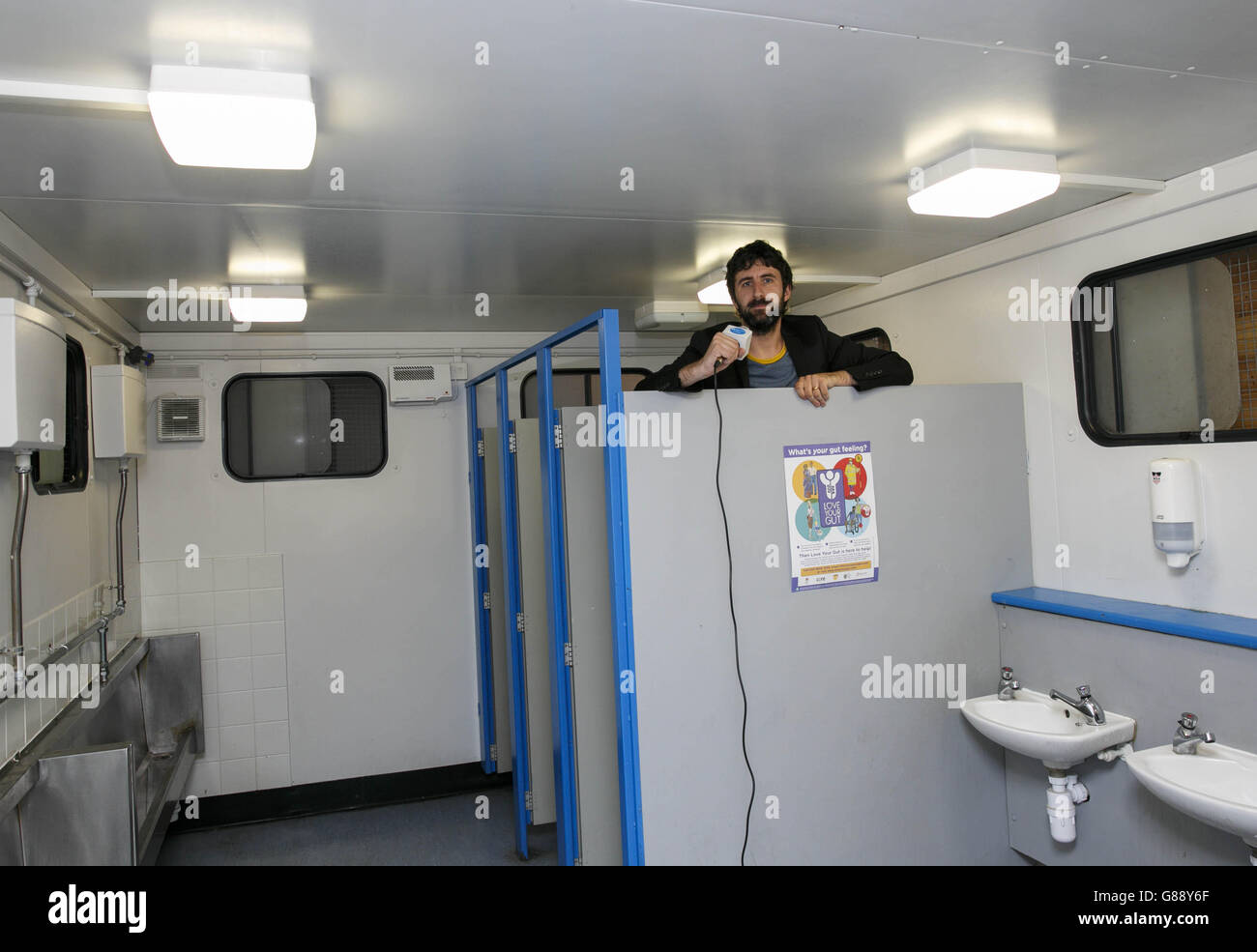Comedian Mark Watson prepares for a secret gig from the public toilets ...
