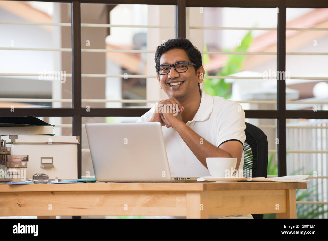 Pakistani man working office hi-res stock photography and images - Alamy