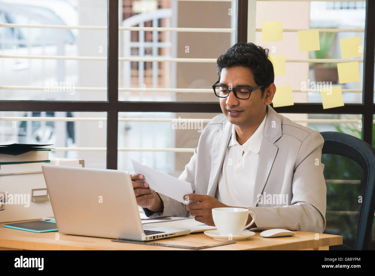 casual indian man with resignation letter Stock Photo - Alamy
