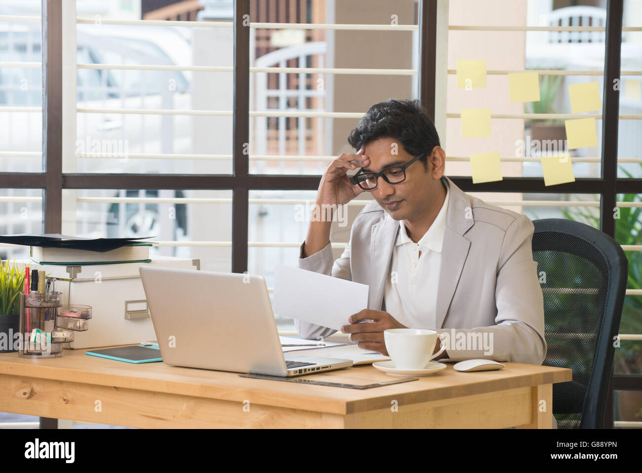 casual indian man with resignation letter Stock Photo - Alamy
