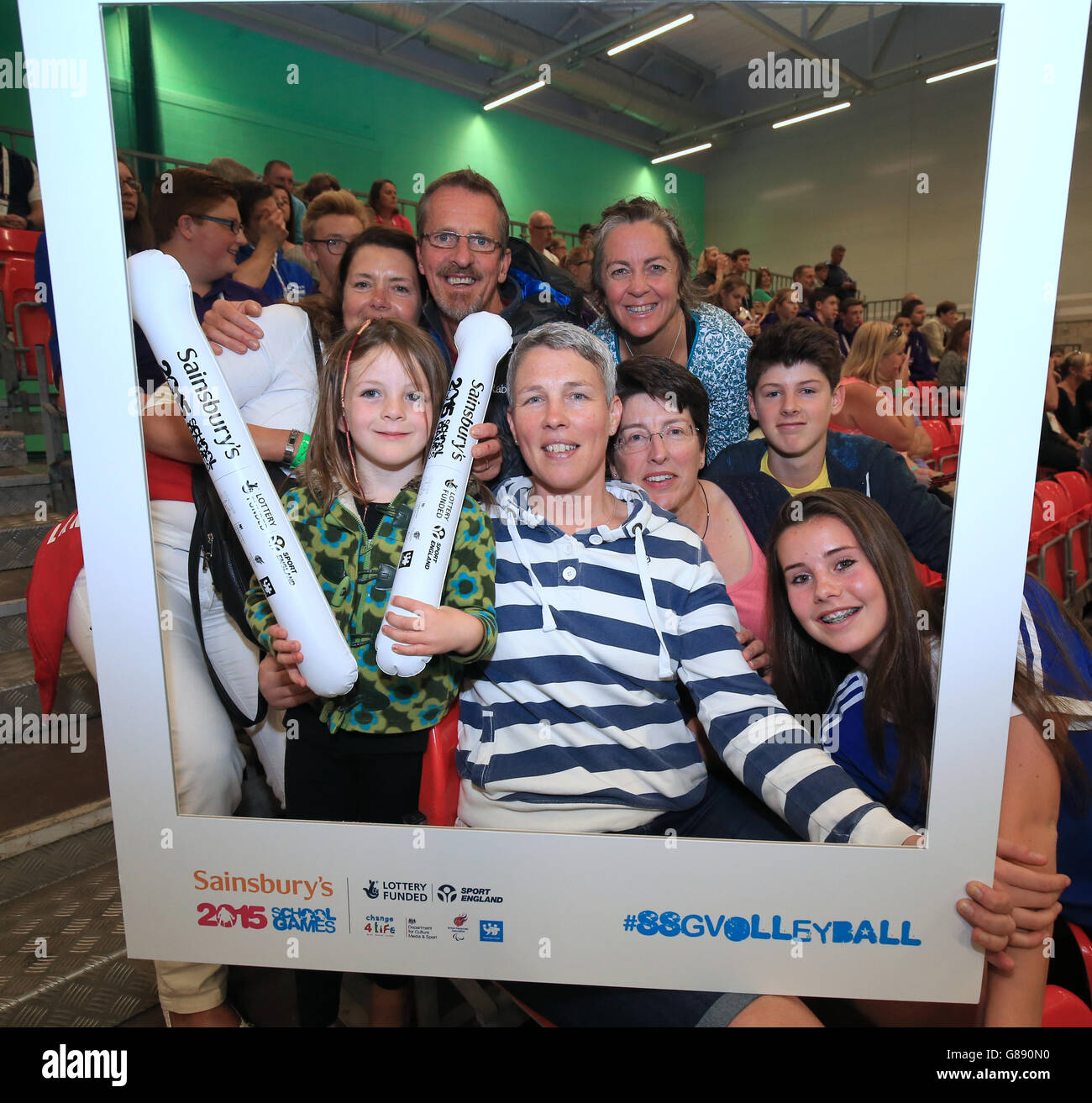 Volleyball supporters pose for a photograph at the Sugden Centre on day ...