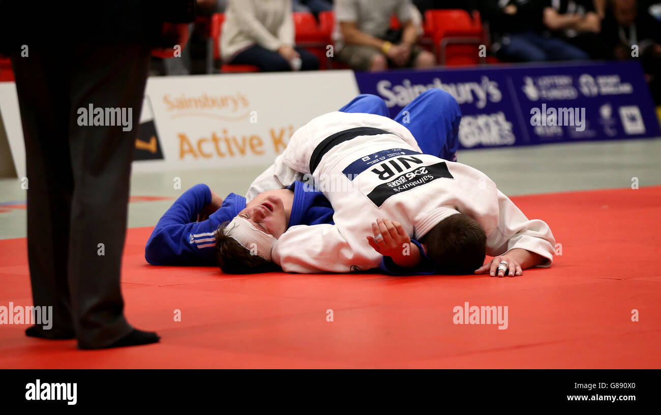 Northern Ireland's James Reid (white) competes against Scotland's ...