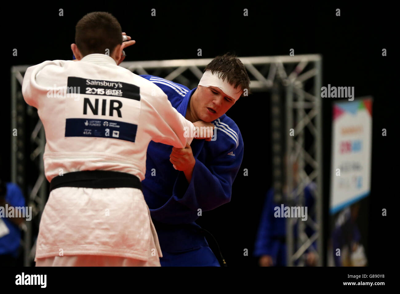 Northern Ireland's James Reid (white) competes against Scotland's ...