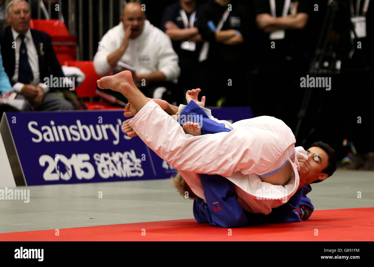 Scotland's Ryan Thomson (white) competes against England's Daniel Holt ...