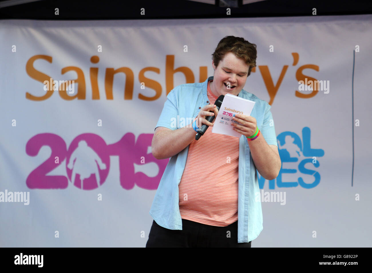 Master of ceremonies, Elliot Mather, speaks to the crowd at the closing ...