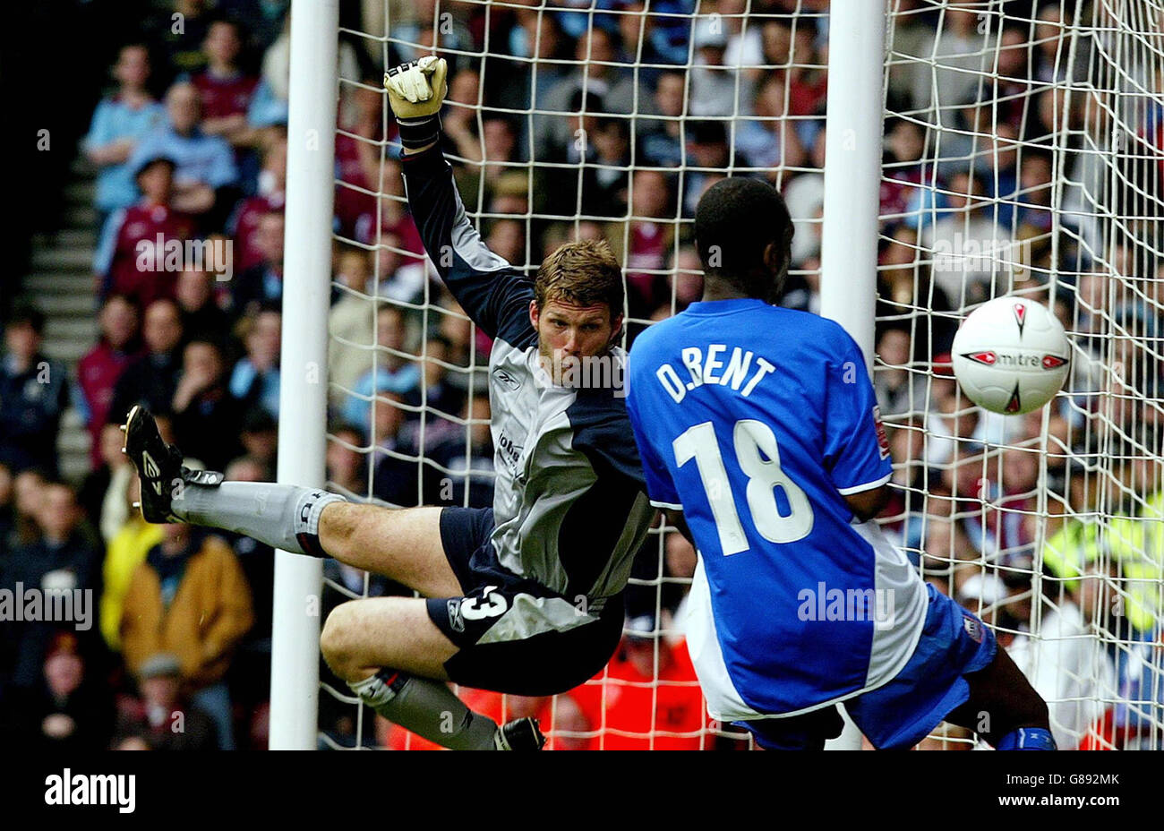 West Ham United goalkeeper James Walker (L) saves a shot form Ipswich ...