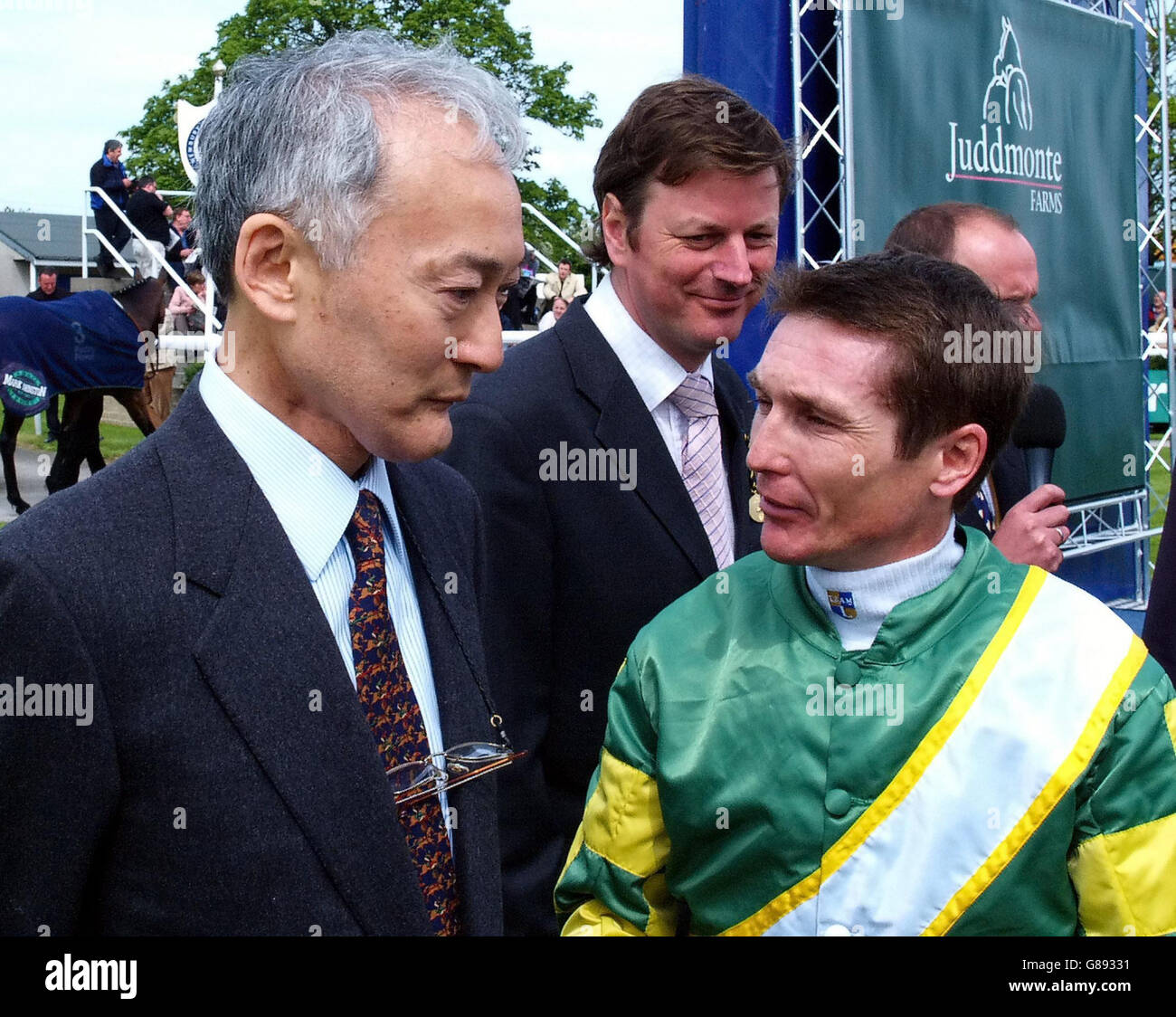 Jockey Philip Robinson talks with Rakti owner Gary Tanaka after winning the, Juddmonte Lockinge ...