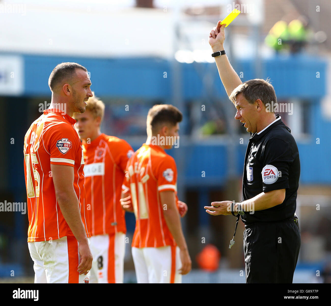 Blackpools tom aldred is booked by referee gary sutton hi-res stock ...
