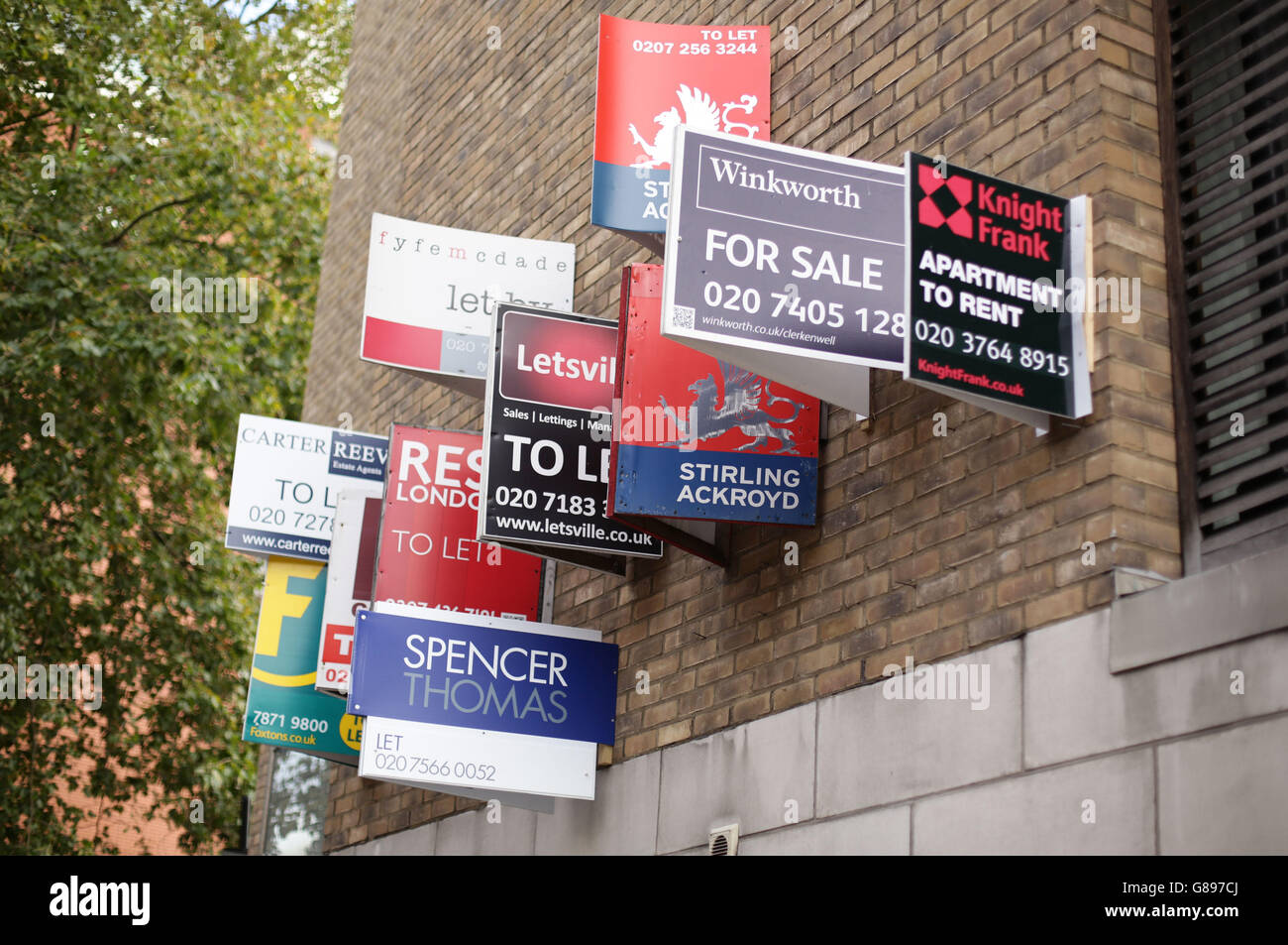 Let by let estate agent signs on wall in london hi-res stock ...