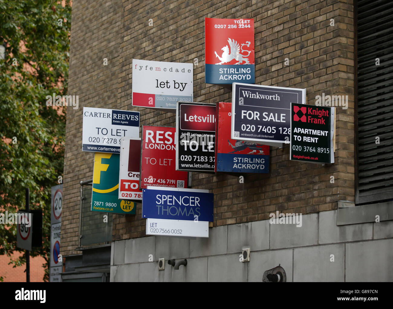 Let by let estate agent signs on wall in london hi-res stock ...