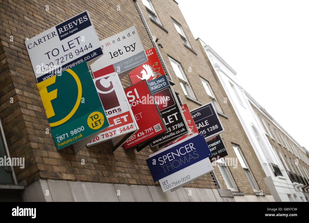 Let by let estate agent signs on wall in london hi-res stock ...