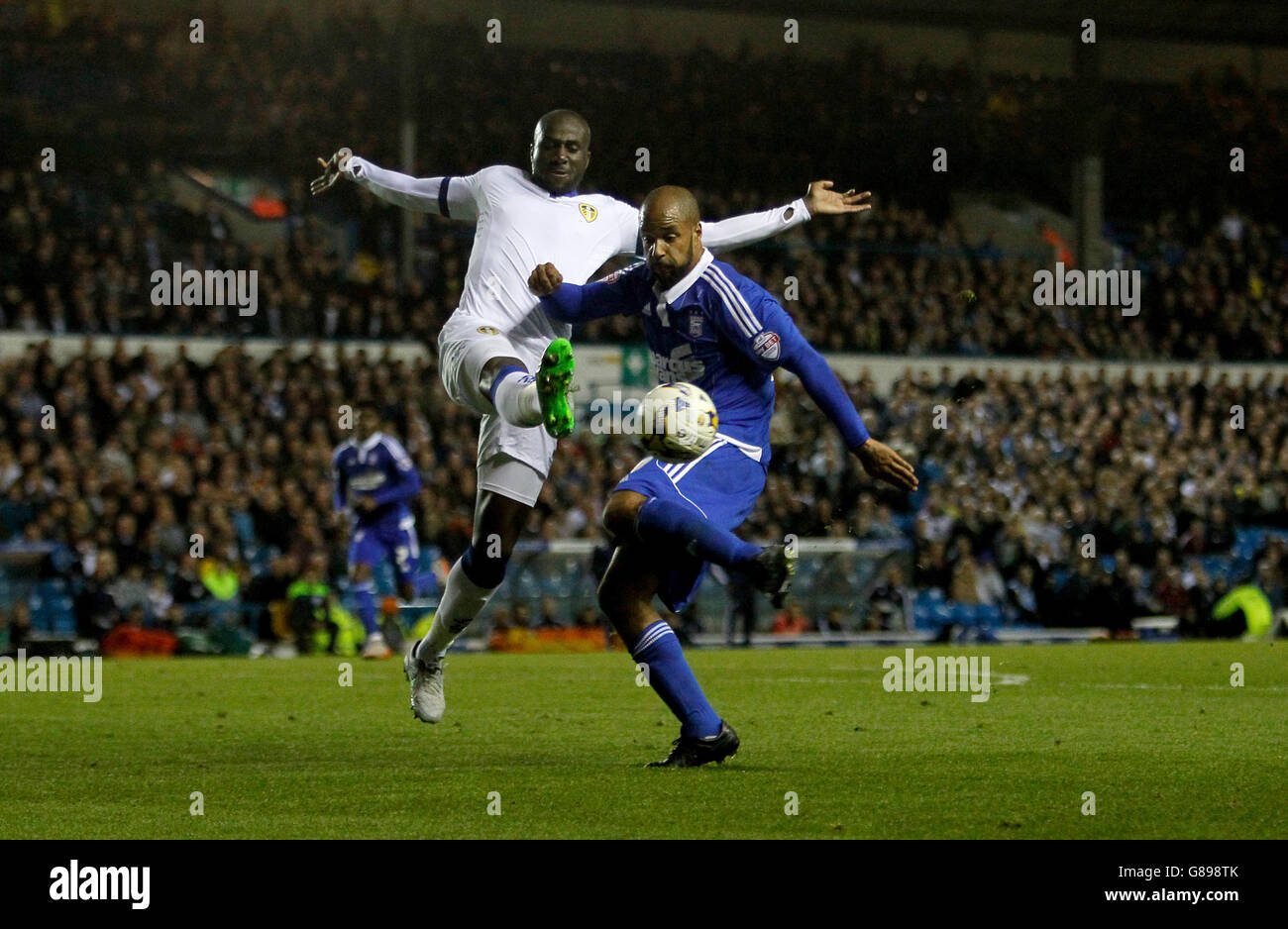 Leeds United's Sol Bamba (left) challenges for the ball with Ipswich ...