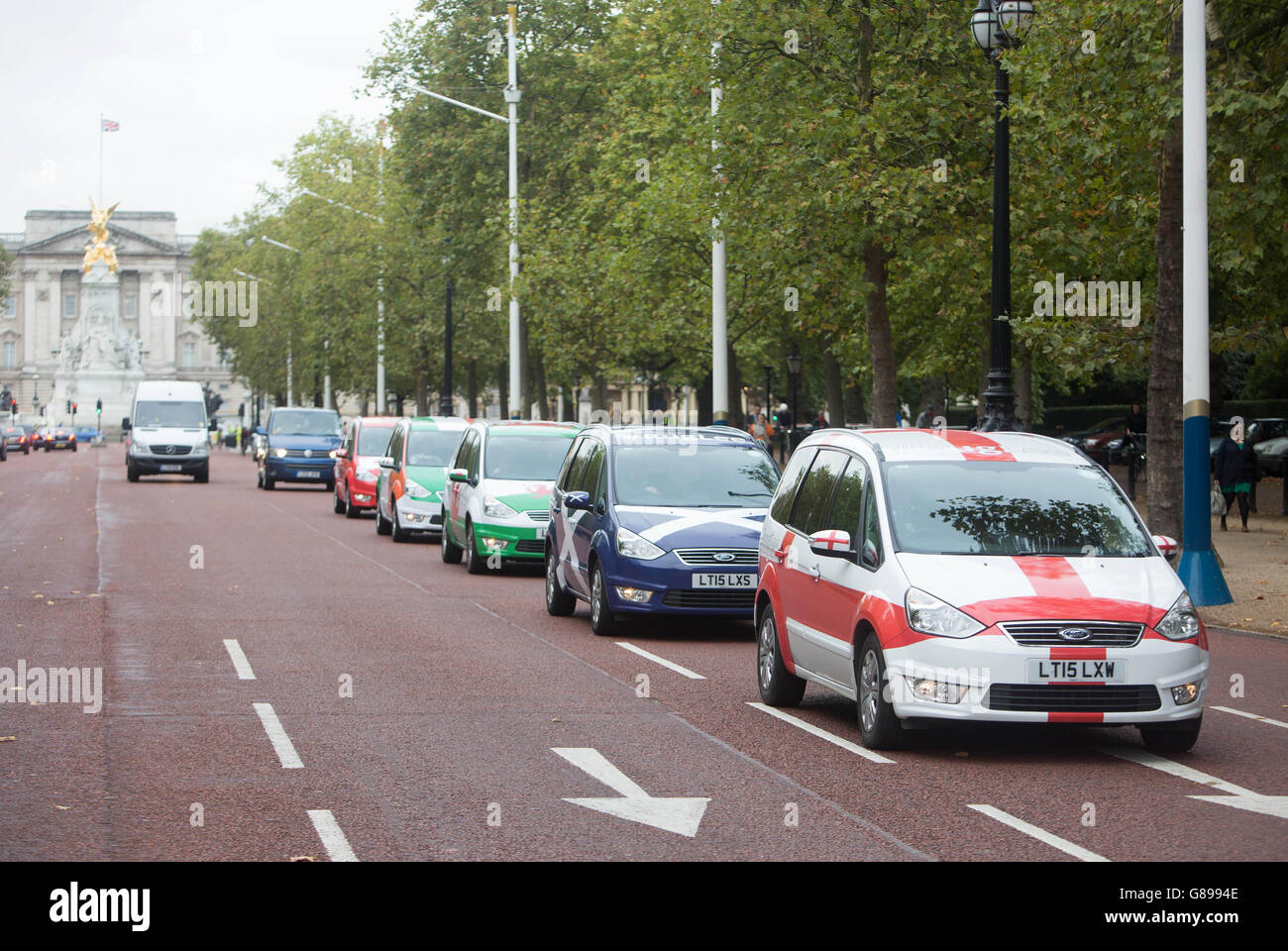 EDITORIAL USE ONLY 20 Addison Lee cars drive down The Mall in London to ...