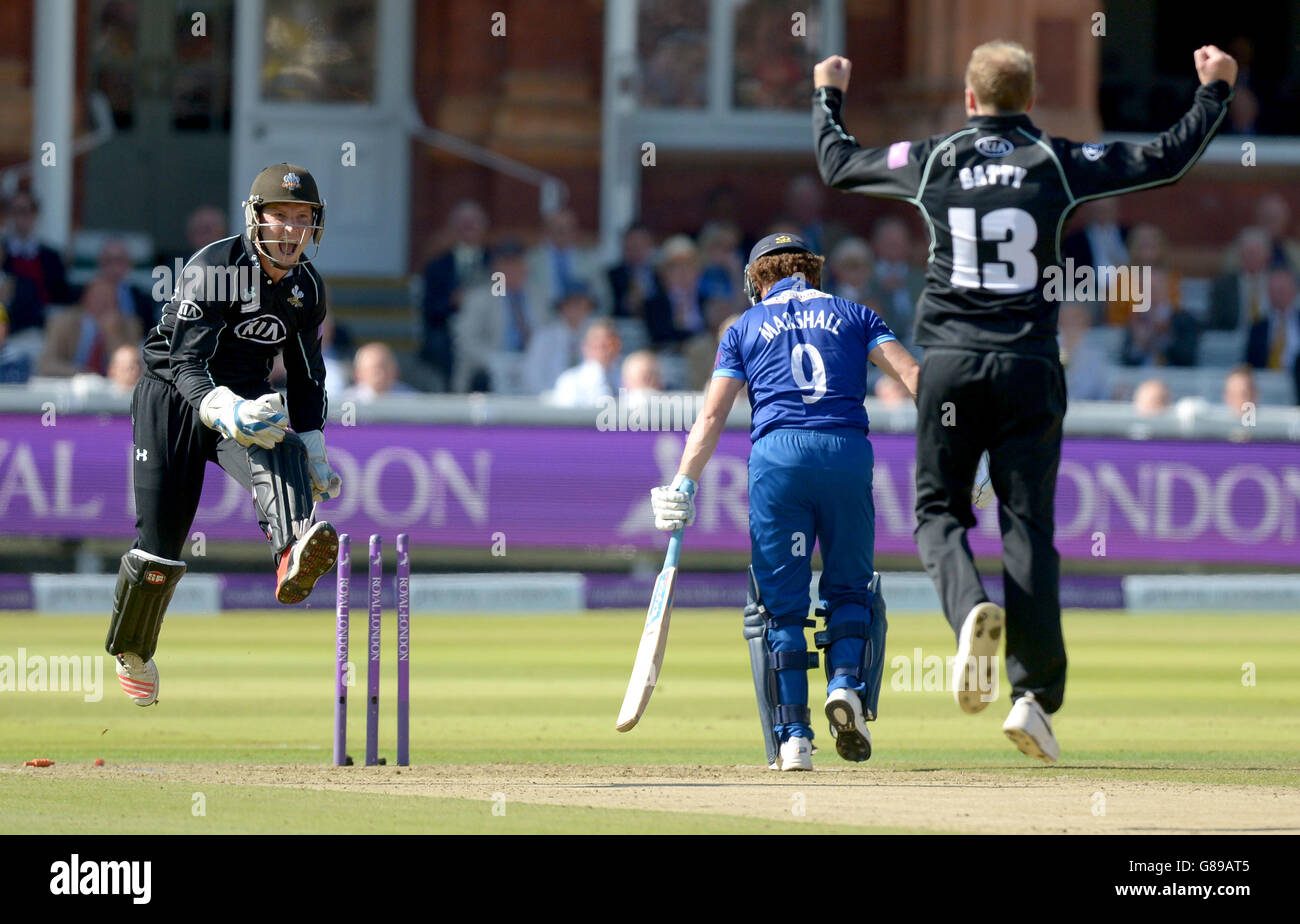 Surrey wicketkeeper Gary Wilson (left) celebrates after stumping ...
