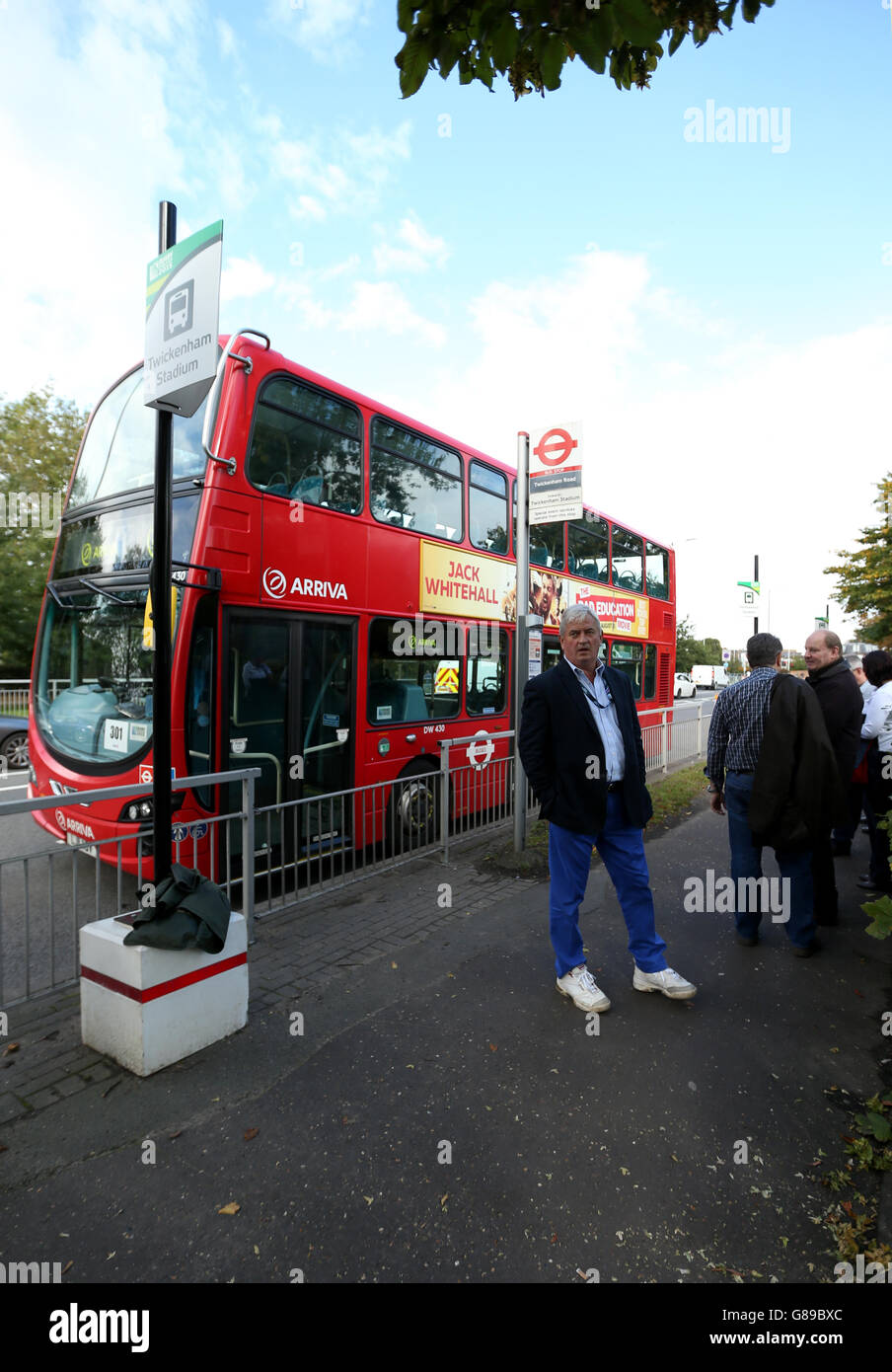 fans await a bus that will take them to Twickenham Stadium before the ...