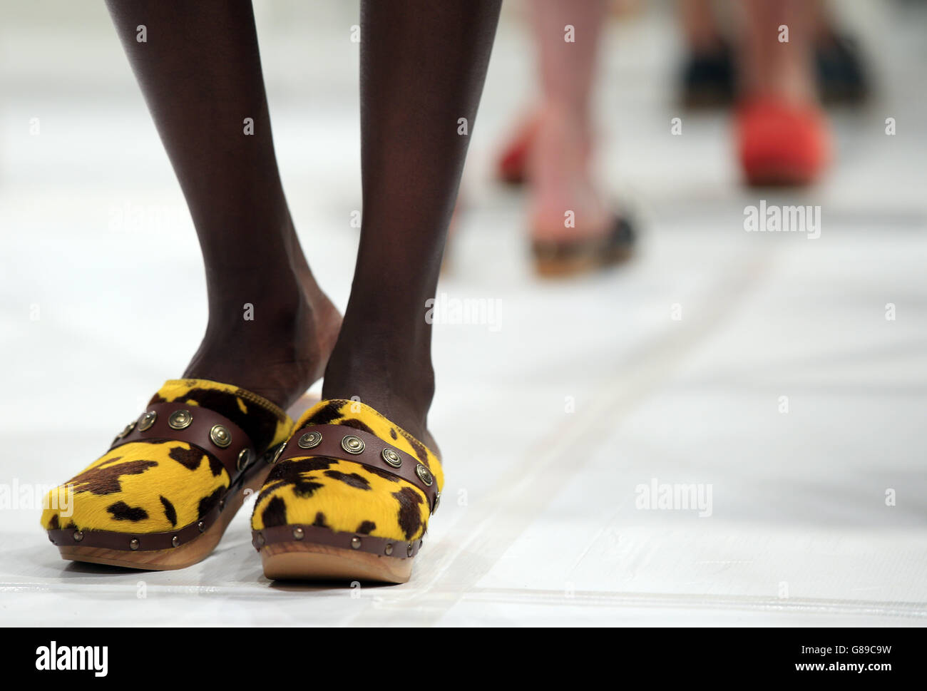Models wear clogs during the Molly Goddard Spring/Summer 2016 London ...