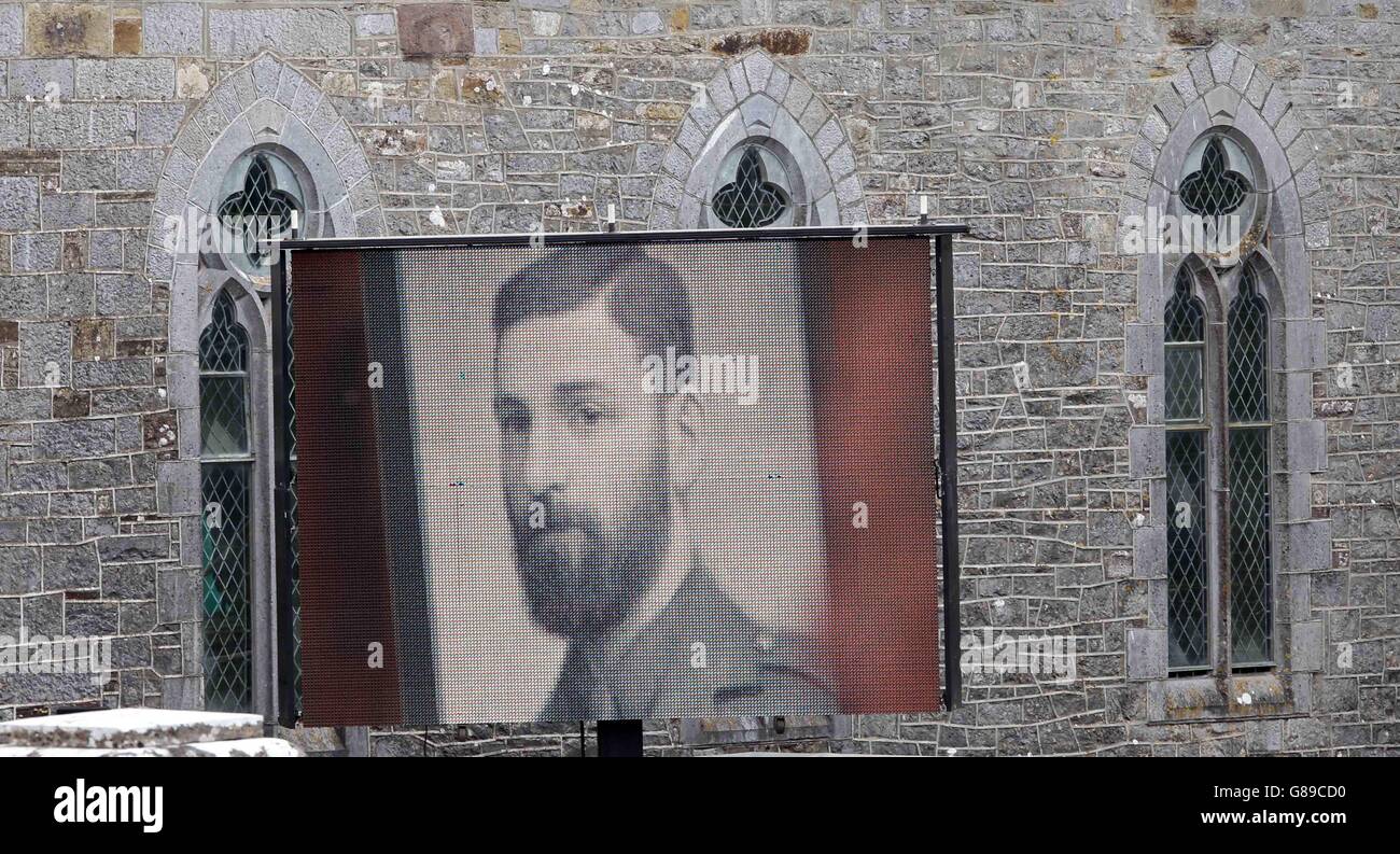 A photograph of Thomas Kent is shown on a big screen outside St ...