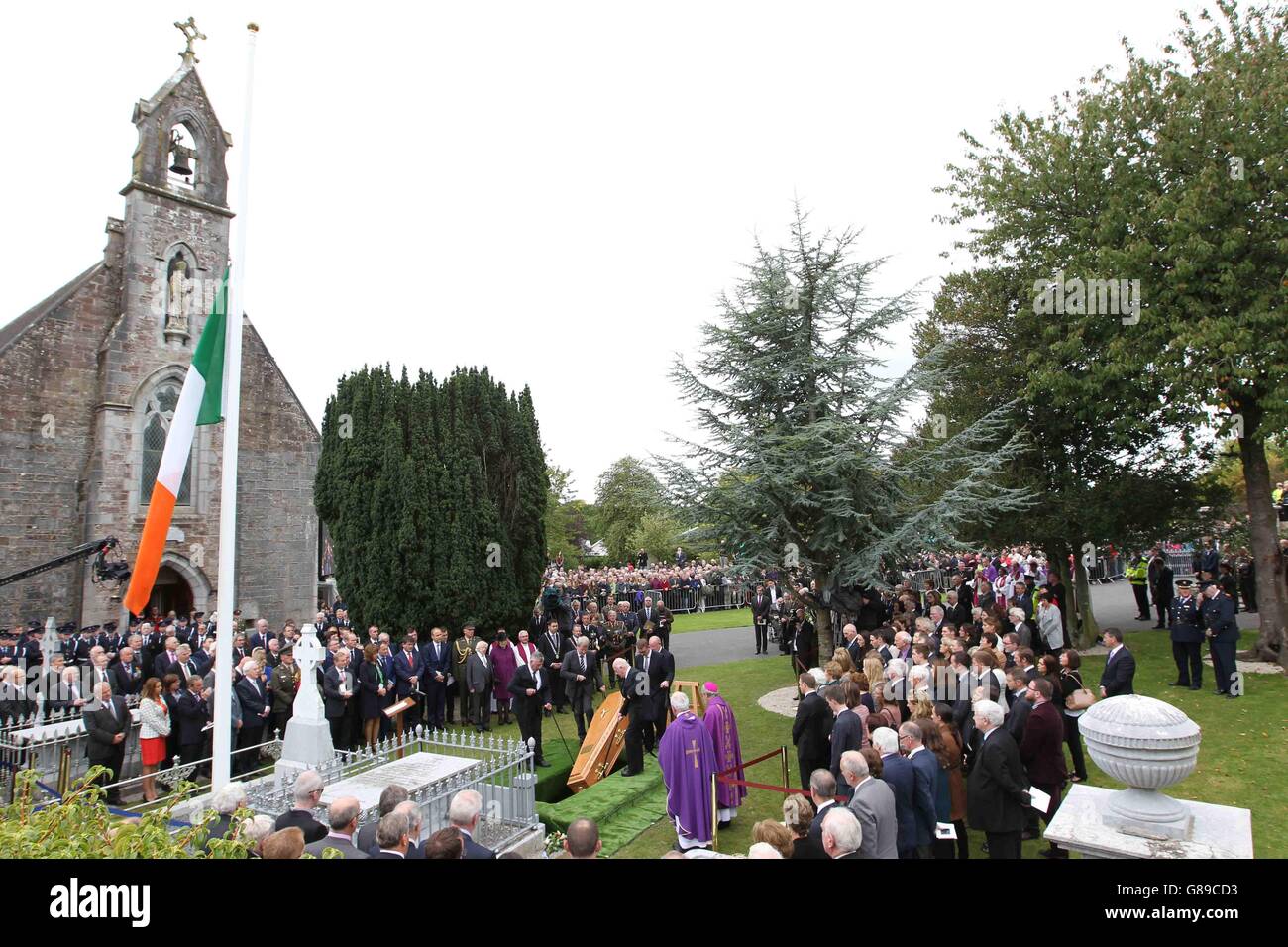 The coffin is lowered into the grave during the state funeral of ...