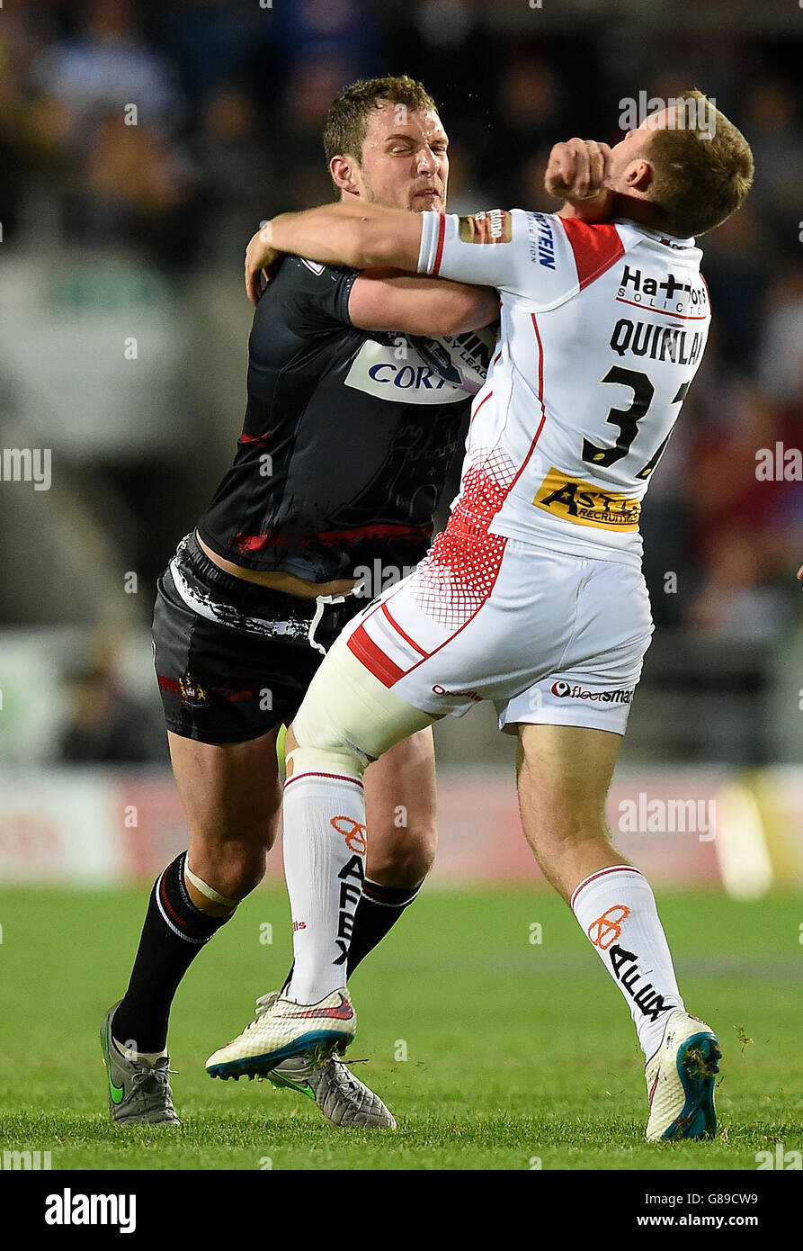 Wigan Warriors Sean O'Loughlin is tacked by St Helens Adam Quinlan ...