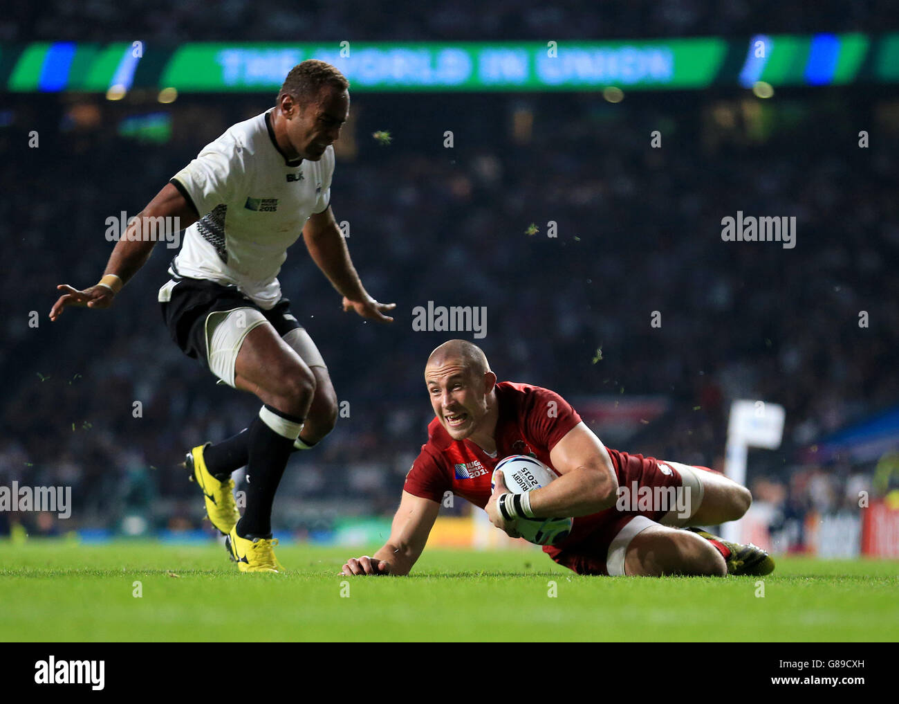 England's Mike Brown scores his side's first try during the Rugby World ...