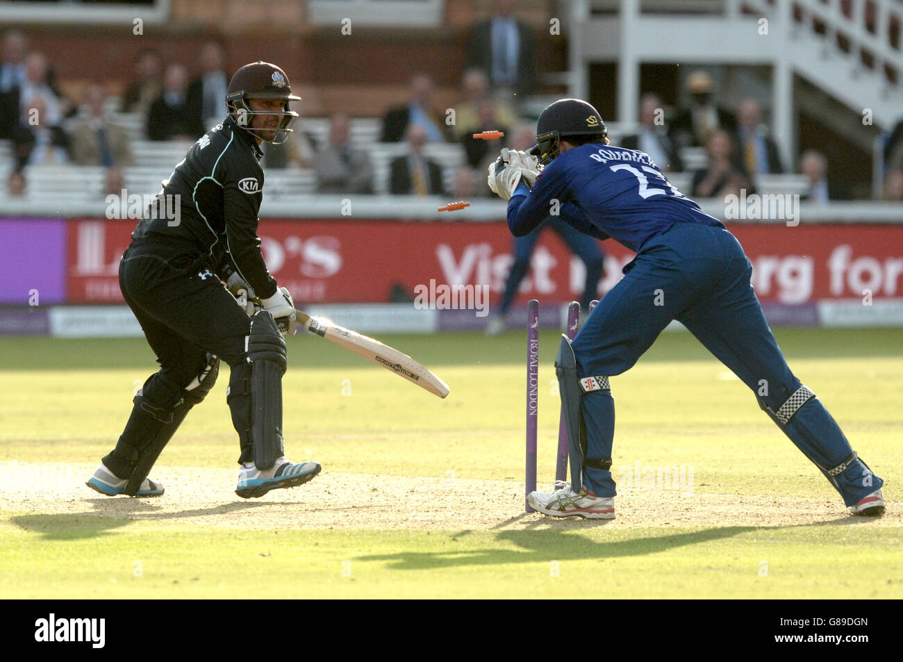 Surrey's Azhar Mahmood (left) is stumped by Gloucestershire's Gareth ...