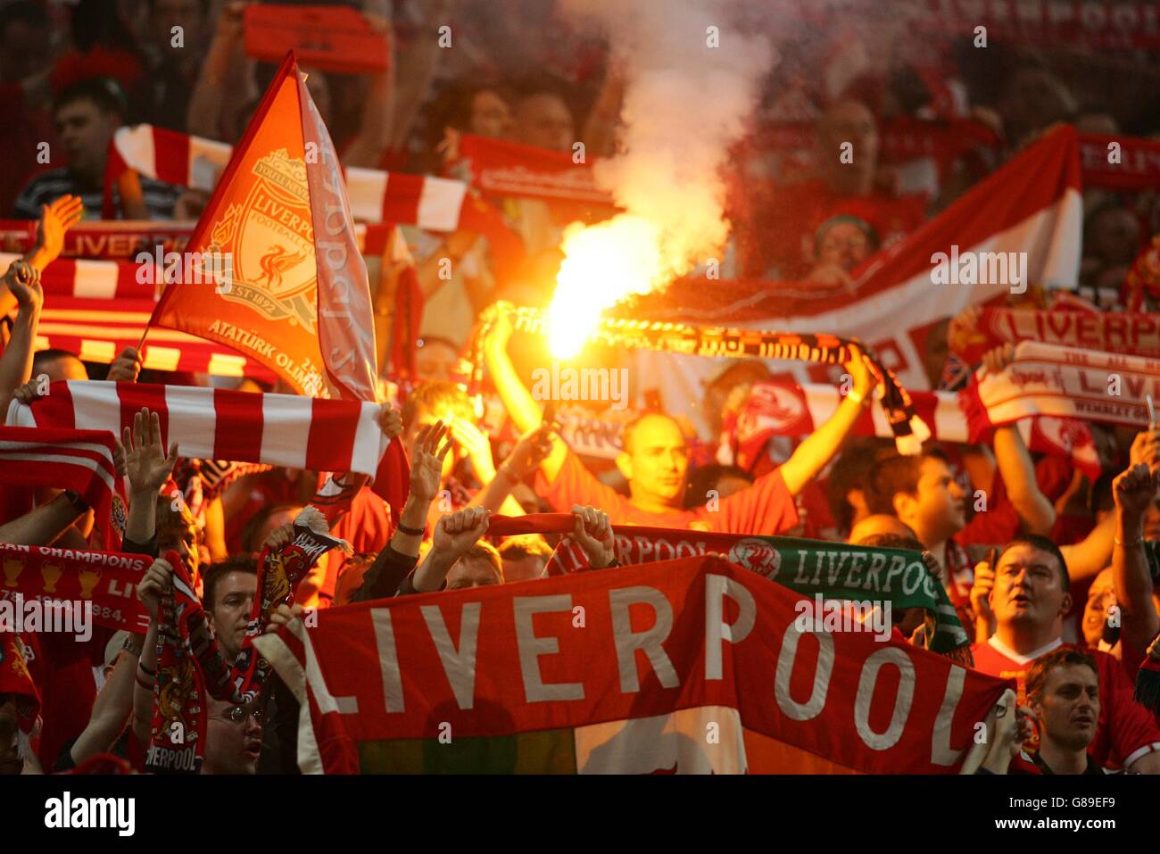 Liverpool fans hold up flares before the game against AC Milan Stock ...