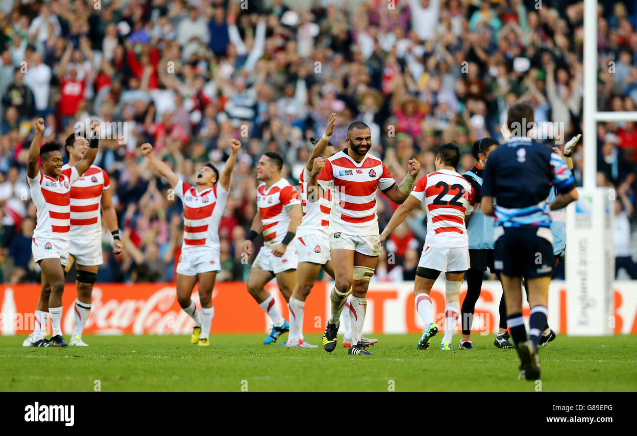 Japan captain Michael Leitch (centre, right) celebrates victory after ...