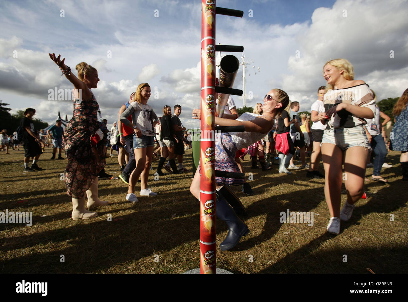 Festival goers limbo dancing pringles party tour area hi-res stock ...
