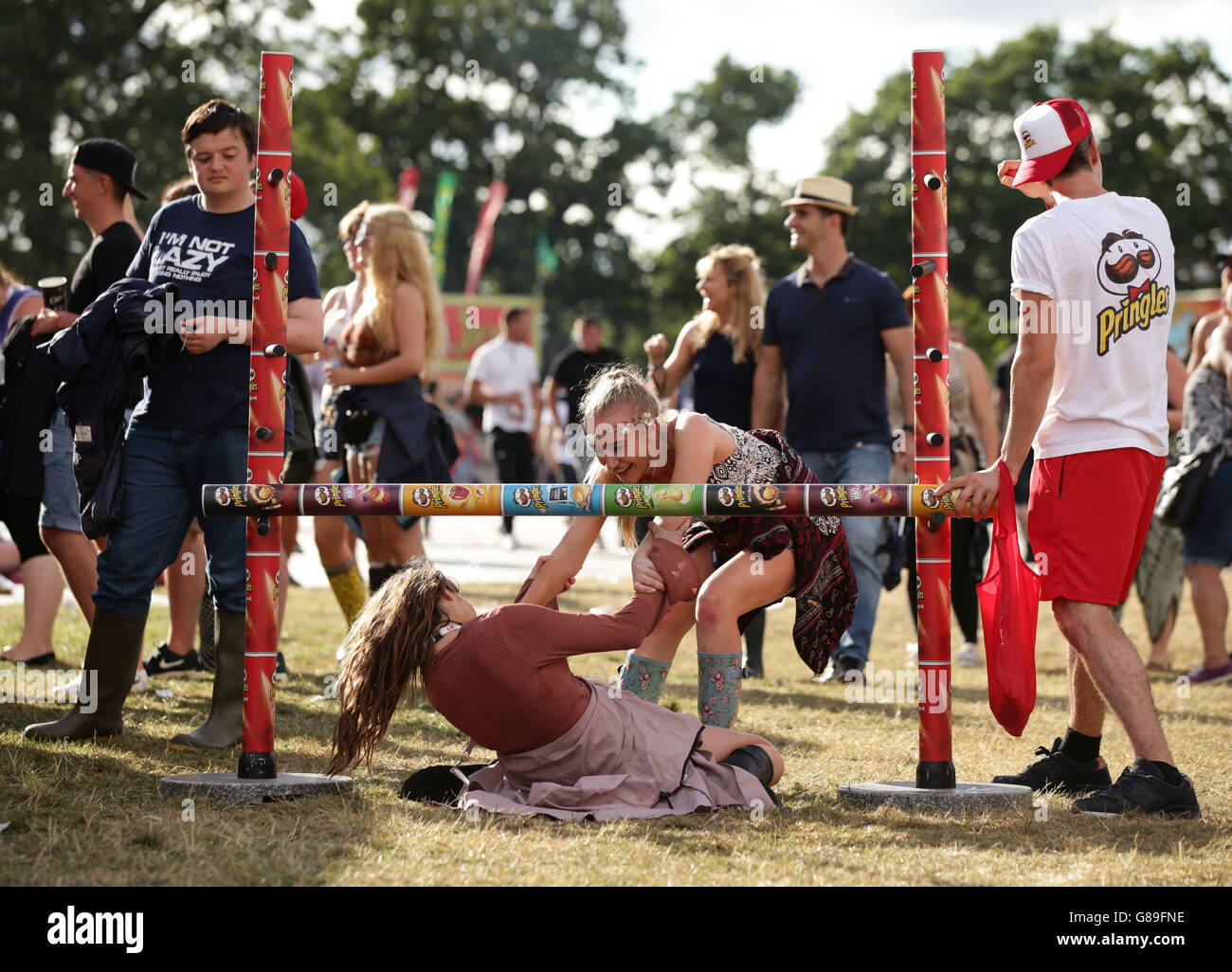 Festival goers limbo dancing pringles party tour area hi-res stock ...