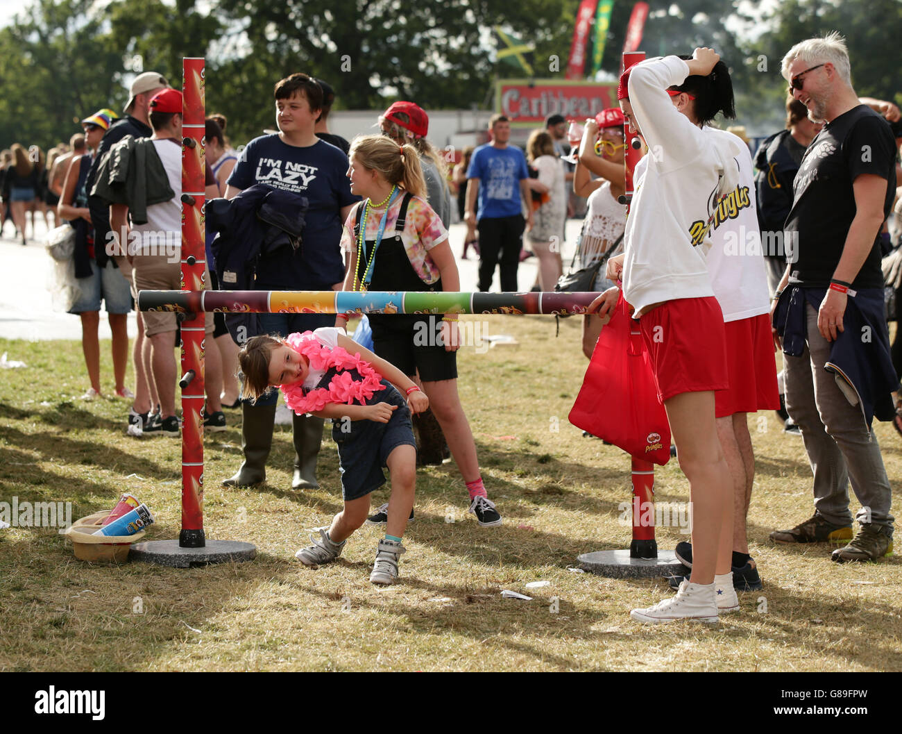 Festival goers limbo dancing pringles party tour area hi-res stock ...