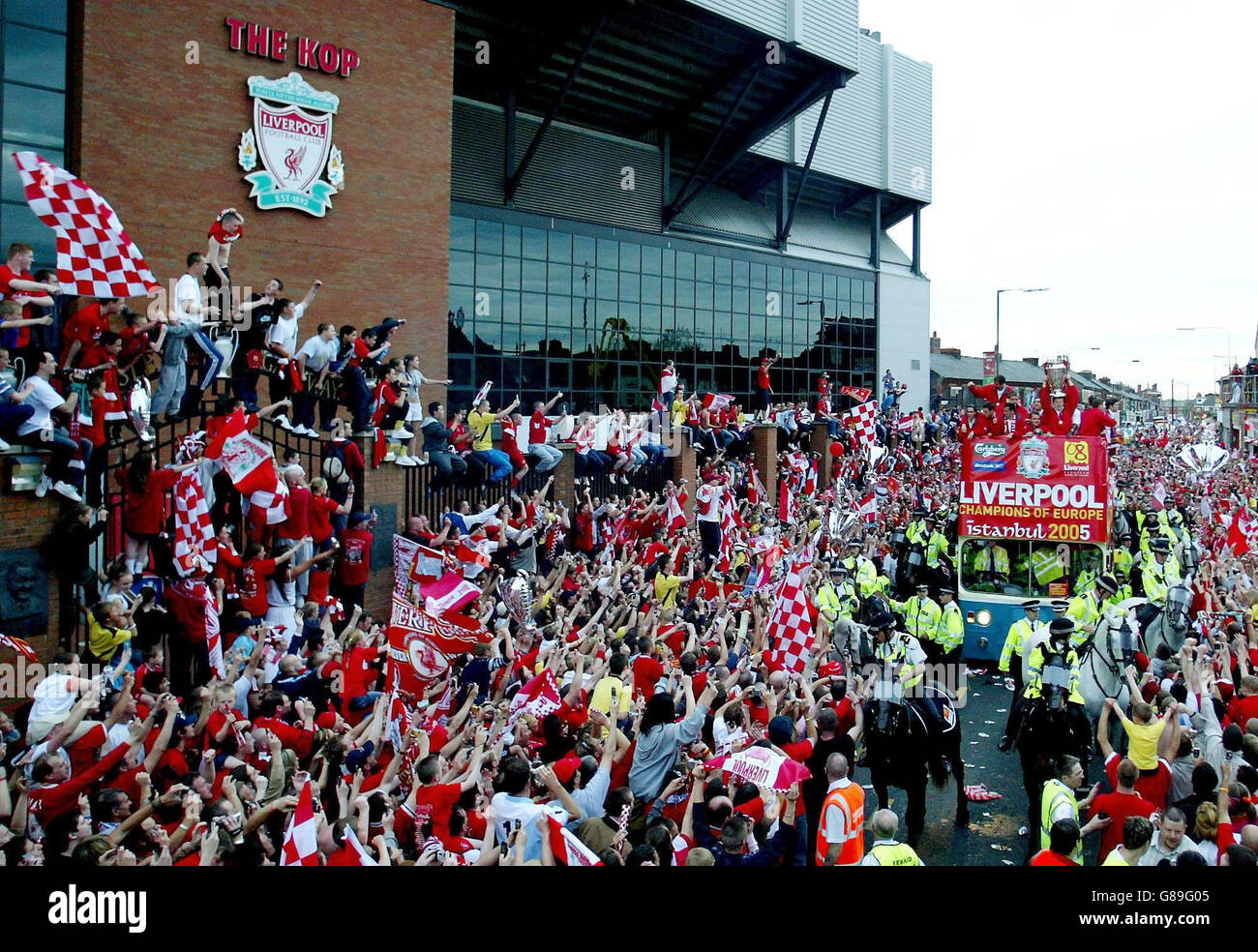 Liverpool players celebrate on an open-top bus during the victory ...