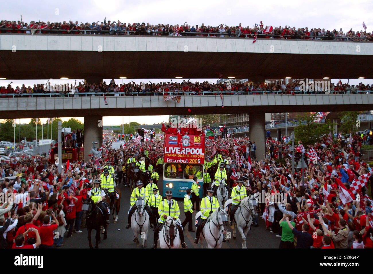 The Liverpool team bus is surrounded by fans as the players arrive back ...