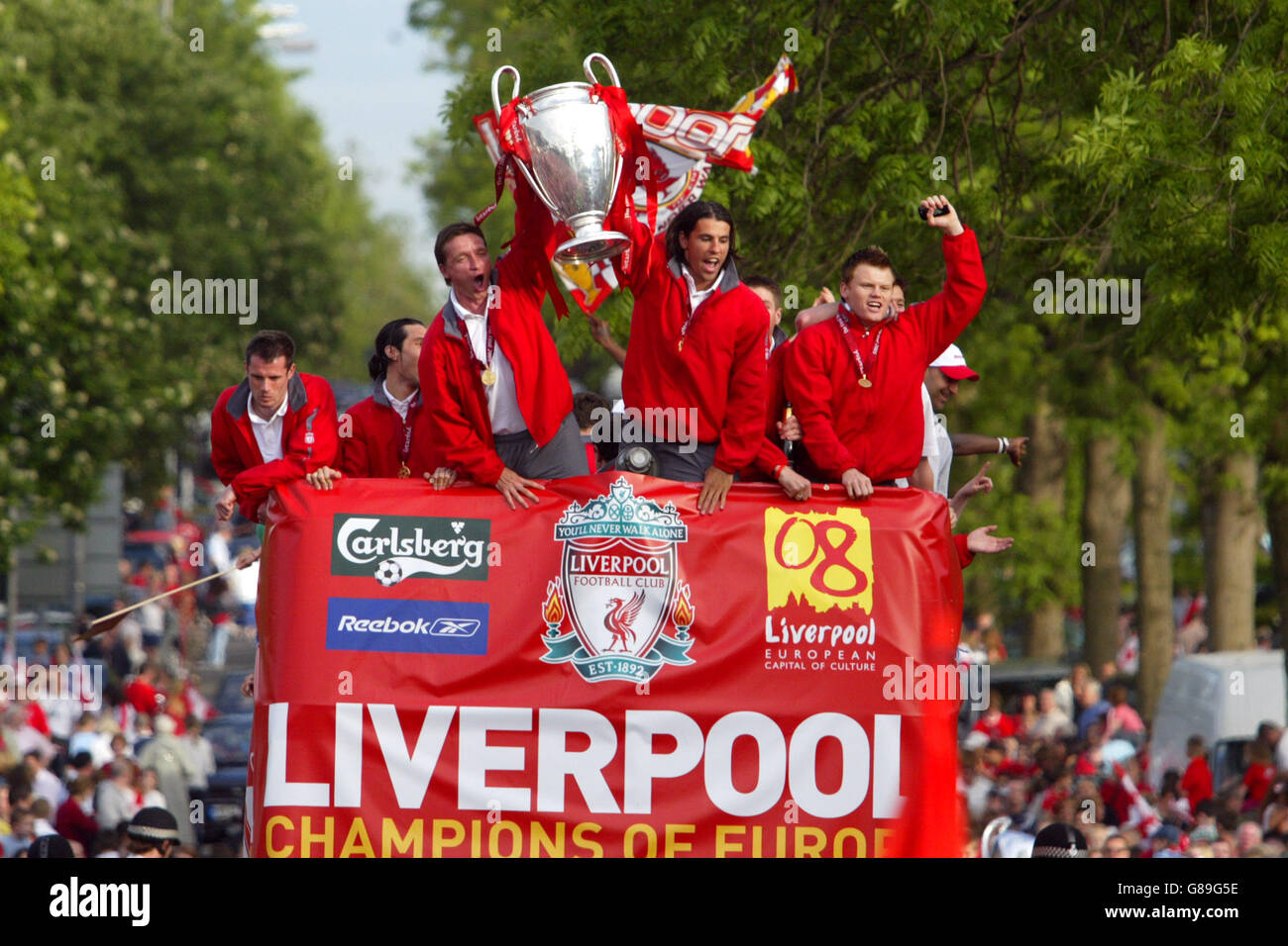 The Liverpool team bus is surrounded by fans as the players arrive back ...