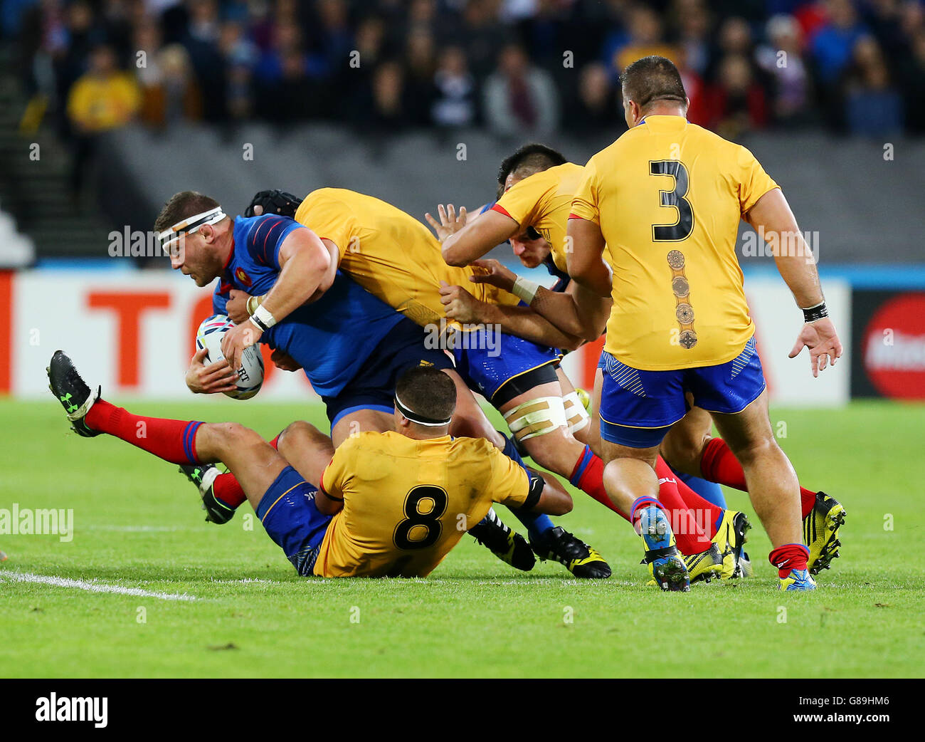 France's Benjamin Kayser is brought down by Romania's Mihai Macovei ...
