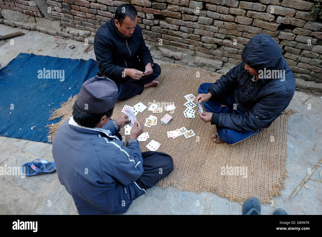 Nepali Men Playing Cards In The Village Of Bungamati A Traditional nepali-men-playing-cards-in-the-village-of-bungamati-a-traditional