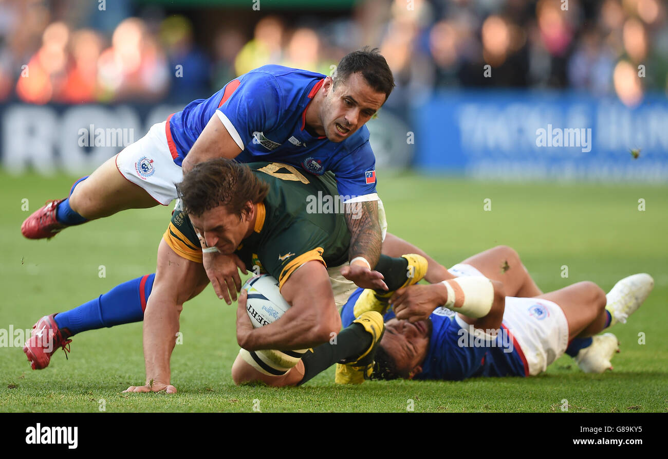 South Africa's Eben Etzebeth (centre) is tackled by Samoa's Michael ...