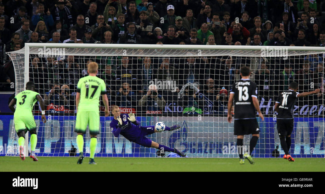 Manchester City goalkeeper Joe Hart saves a penalty from Borussia ...