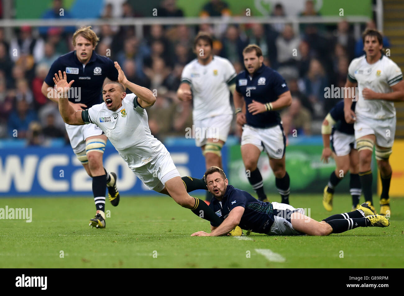Scotland's Greig Laidlaw (right) hauls down South Africa's Bryan Habana ...
