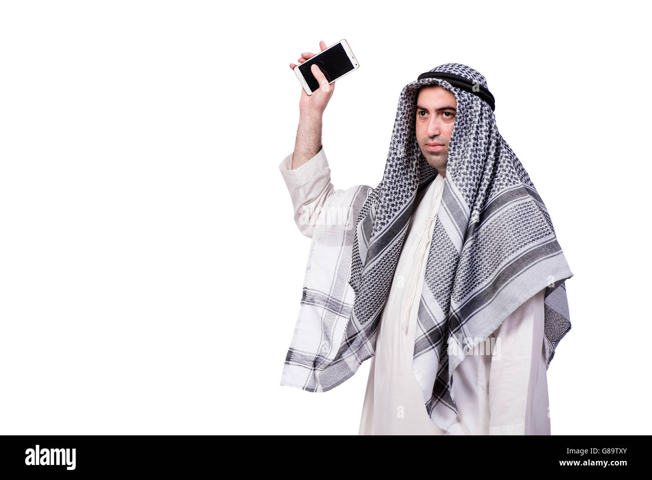 Arab man with his mobile phone isolated on white Stock Photo - Alamy