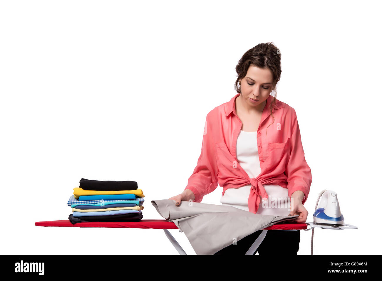 Young woman doing ironing isolated on white Stock Photo - Alamy