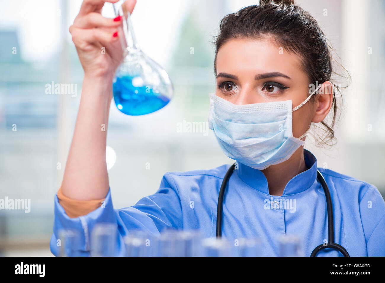Woman doctor doing chemical tests in laboratory Stock Photo - Alamy
