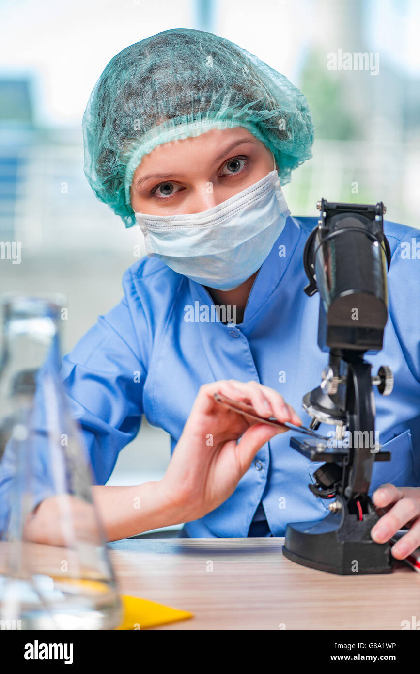 Experienced lab assistant working on chemical solutions Stock Photo - Alamy