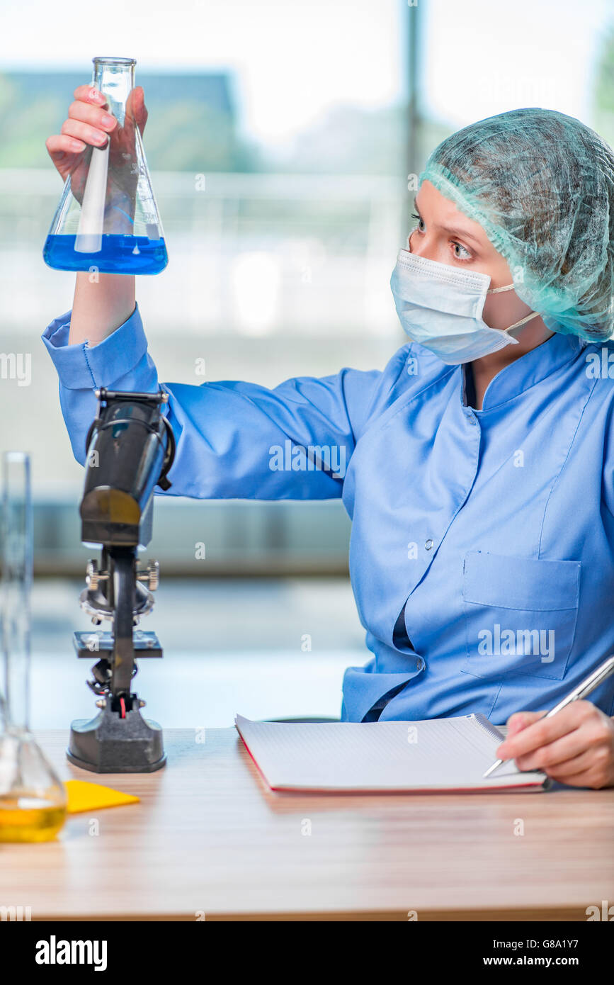 Experienced lab assistant working on chemical solutions Stock Photo - Alamy