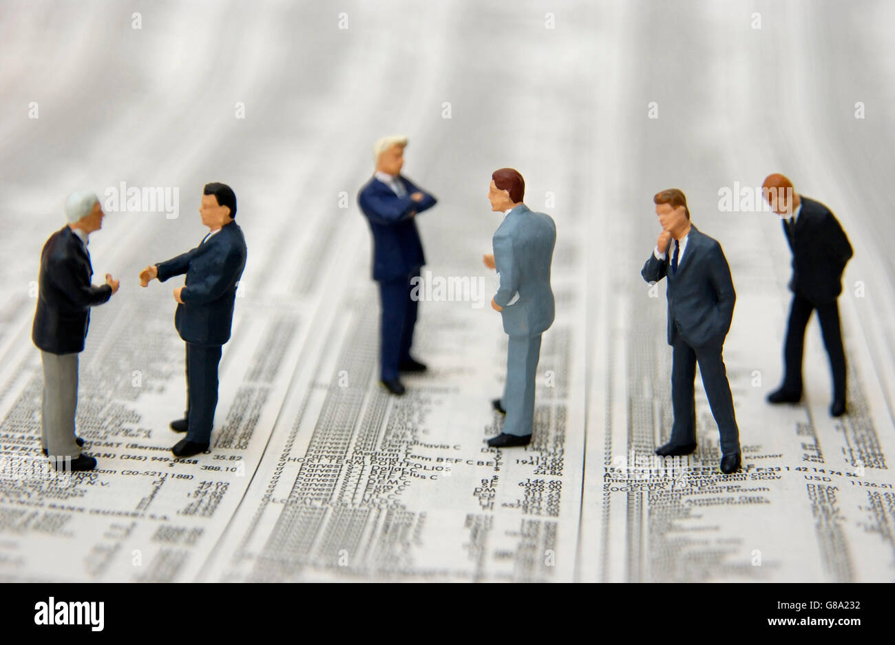 Miniature figurines on stock-market prices Stock Photo - Alamy