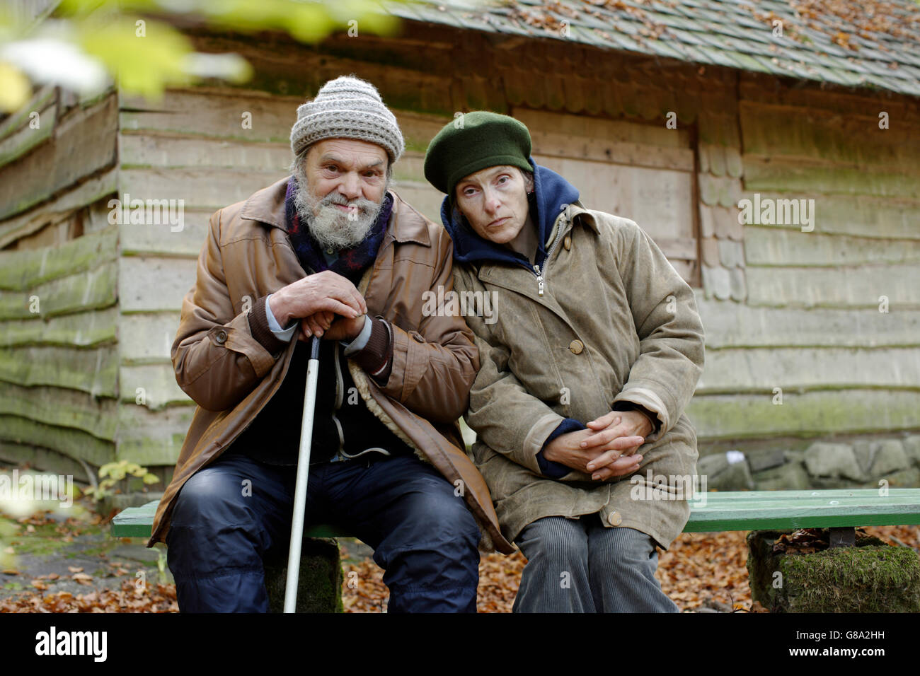 Homeless couple in front of a forest hut, wood near Carlsbad, Karlovy ...