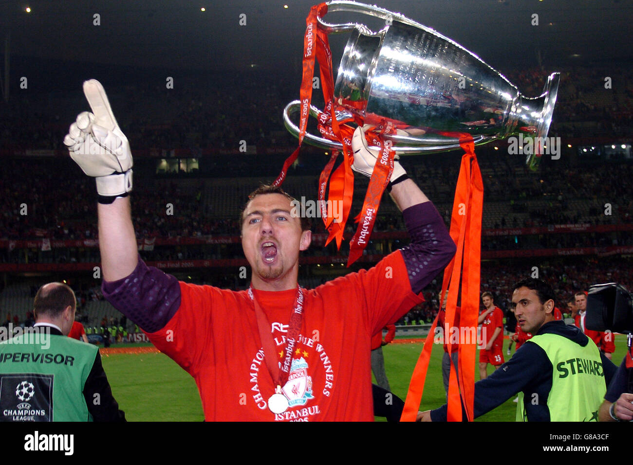 Liverpool goalkeeper jerzy dudek lifts the uefa champions league trophy ...