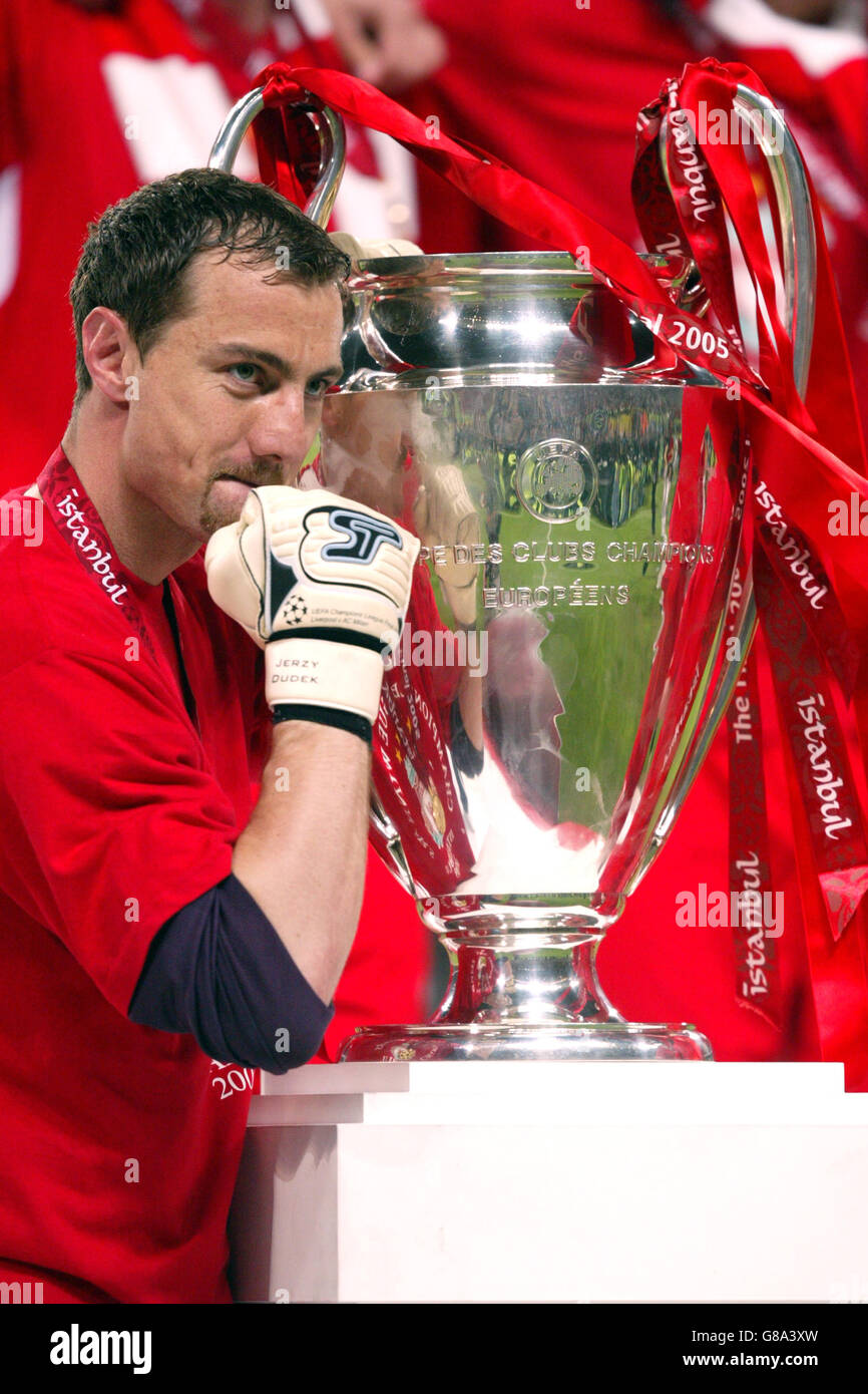 Liverpool goalkeeper jerzy dudek celebrates victory with the trophy hi ...